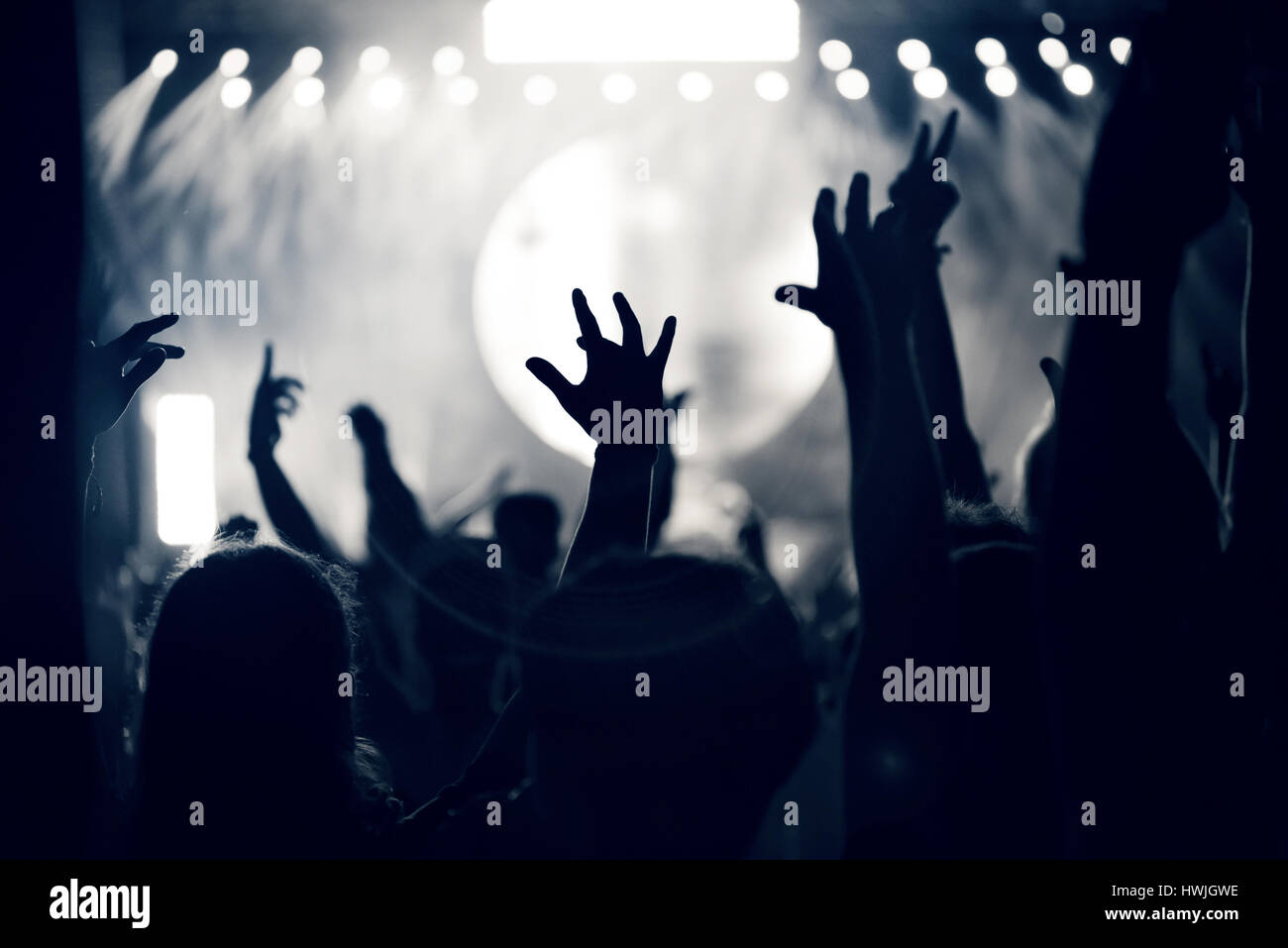 Crowd at a music concert with raising hands up, toned image Stock Photo ...