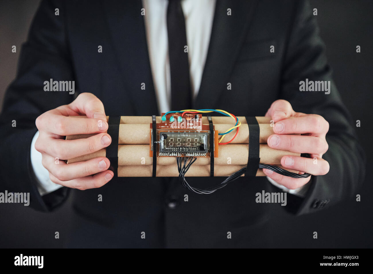 Man terrorist in a black suit with explosives and detonators Stock ...