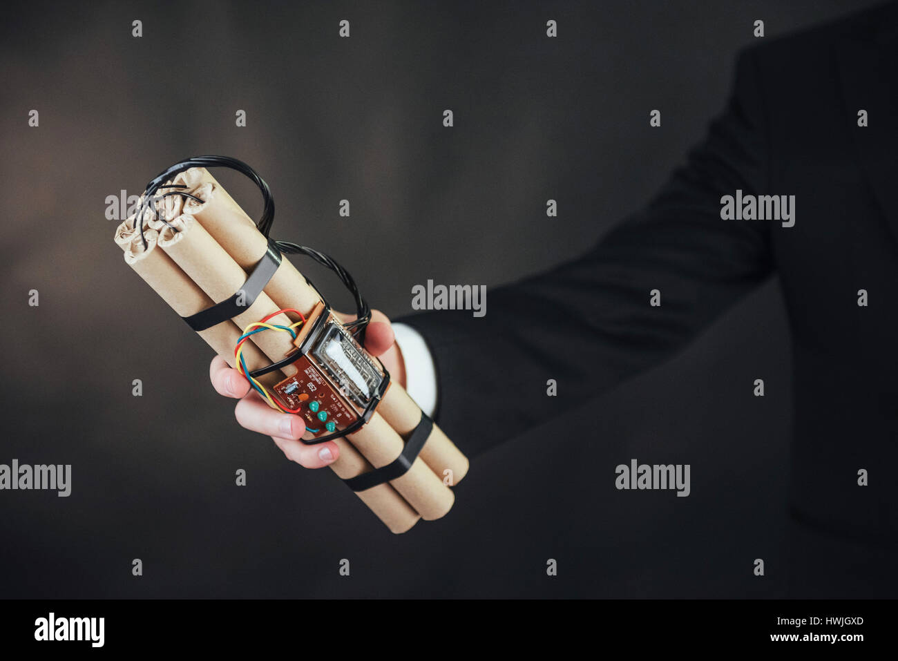 Man terrorist in a black suit with explosives and detonators Stock ...