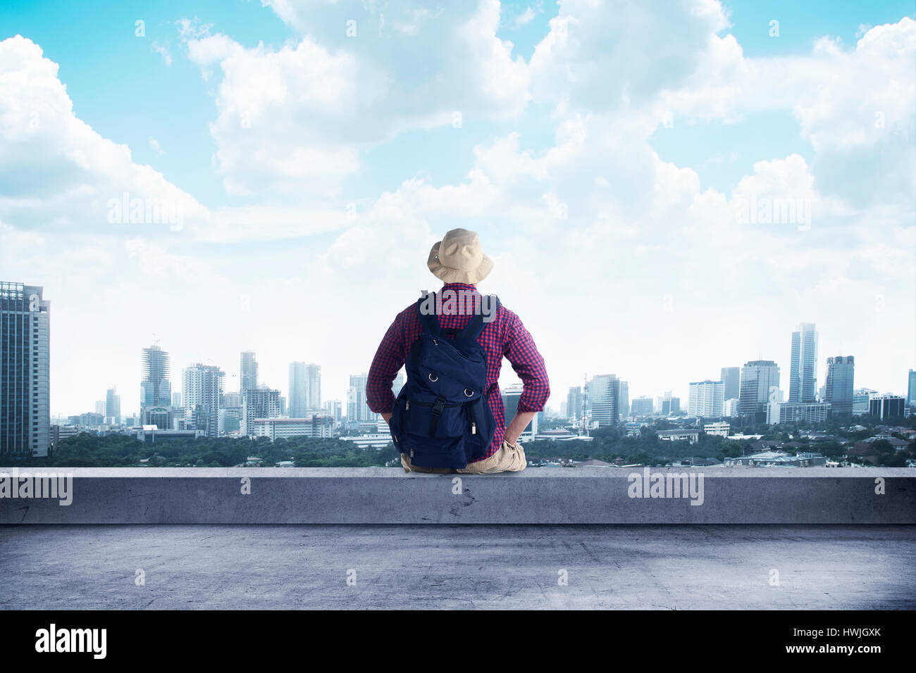 Man sitting on rooftop hi-res stock photography and images - Alamy