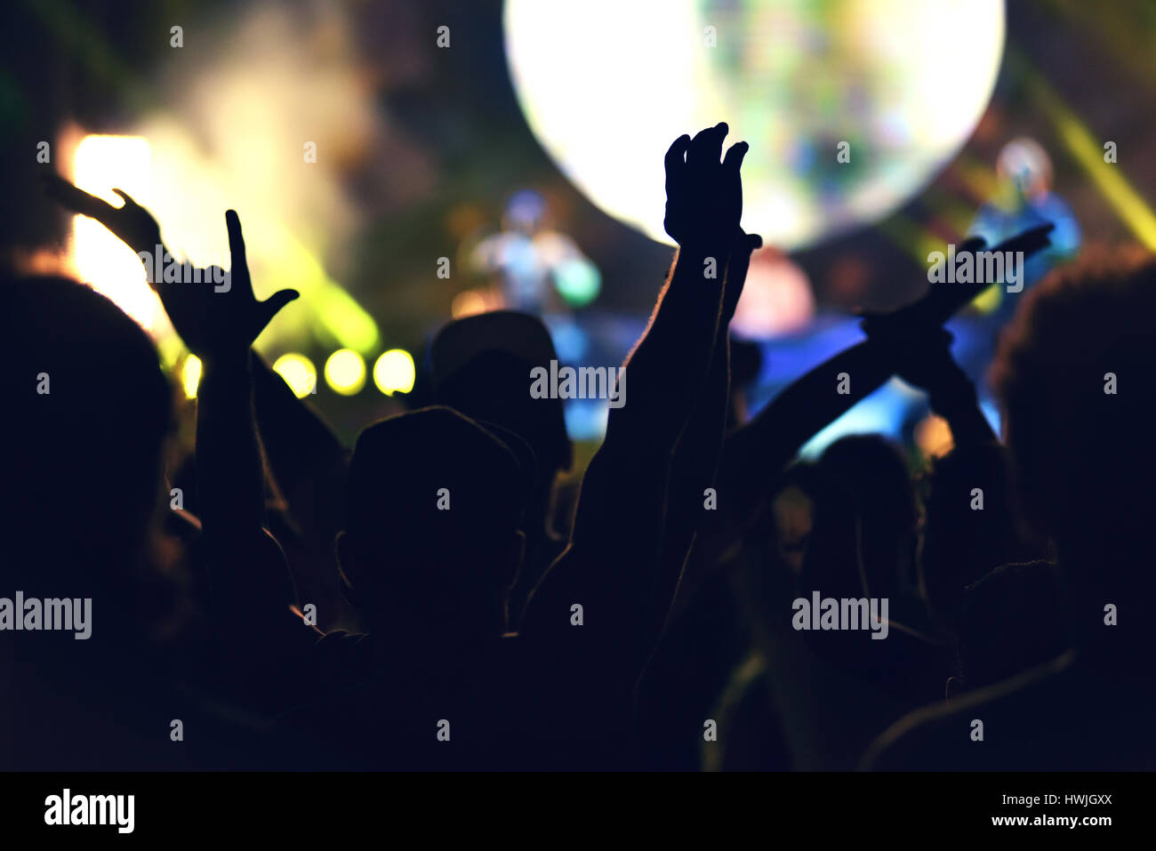 Crowd rocking during a concert with raised arms. Toned image Stock ...