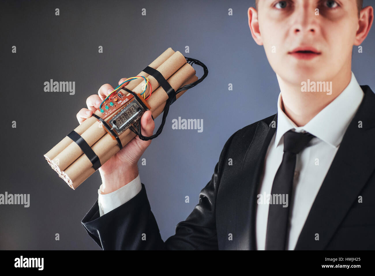 Man terrorist in a black suit with explosives and detonators Stock ...