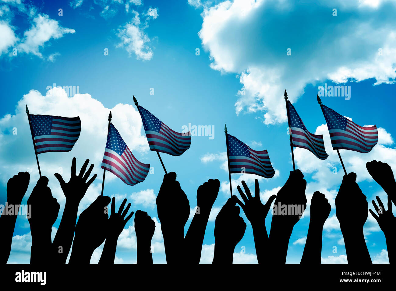 Group of people waving small USA flag facing blue sky Stock Photo - Alamy