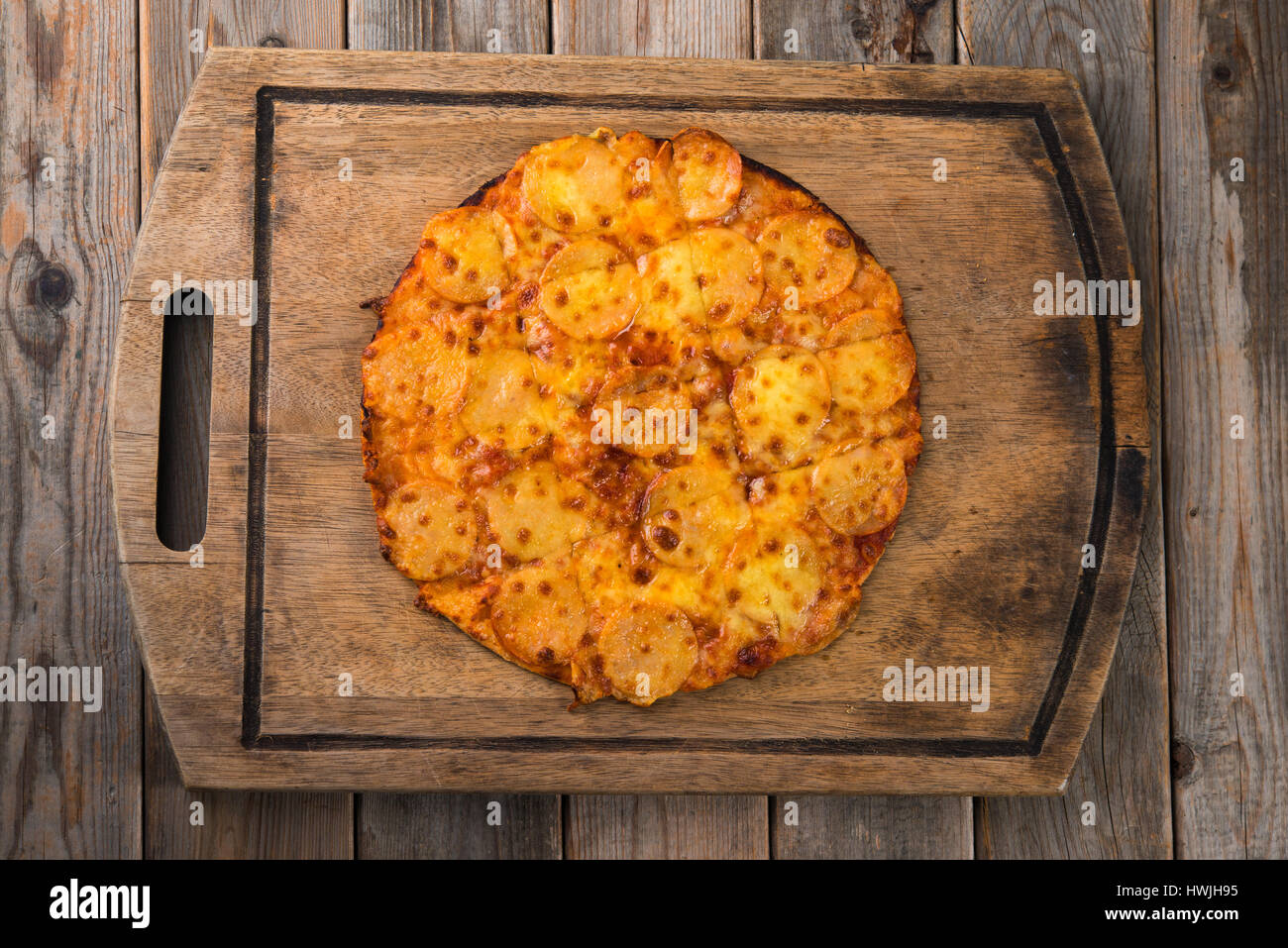 pepperoni pizza with rustic background top down view Stock Photo - Alamy