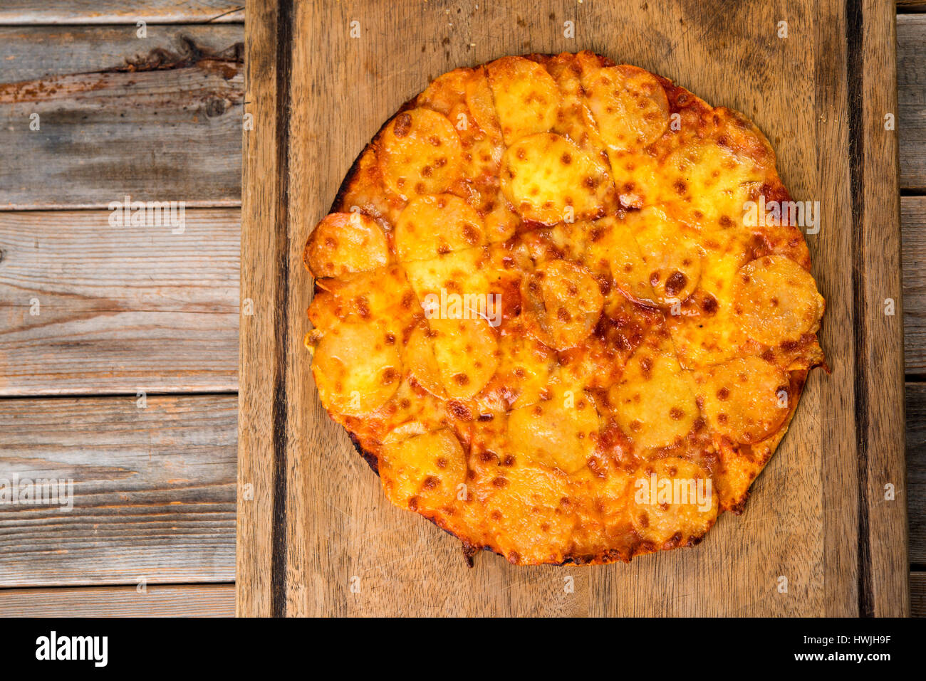 pepperoni pizza with rustic background top down view Stock Photo - Alamy