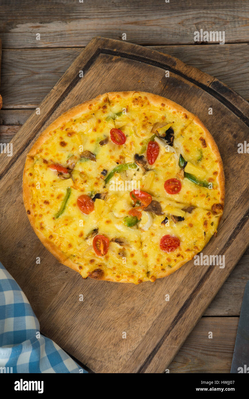 pizza top view in rustic setting Stock Photo - Alamy