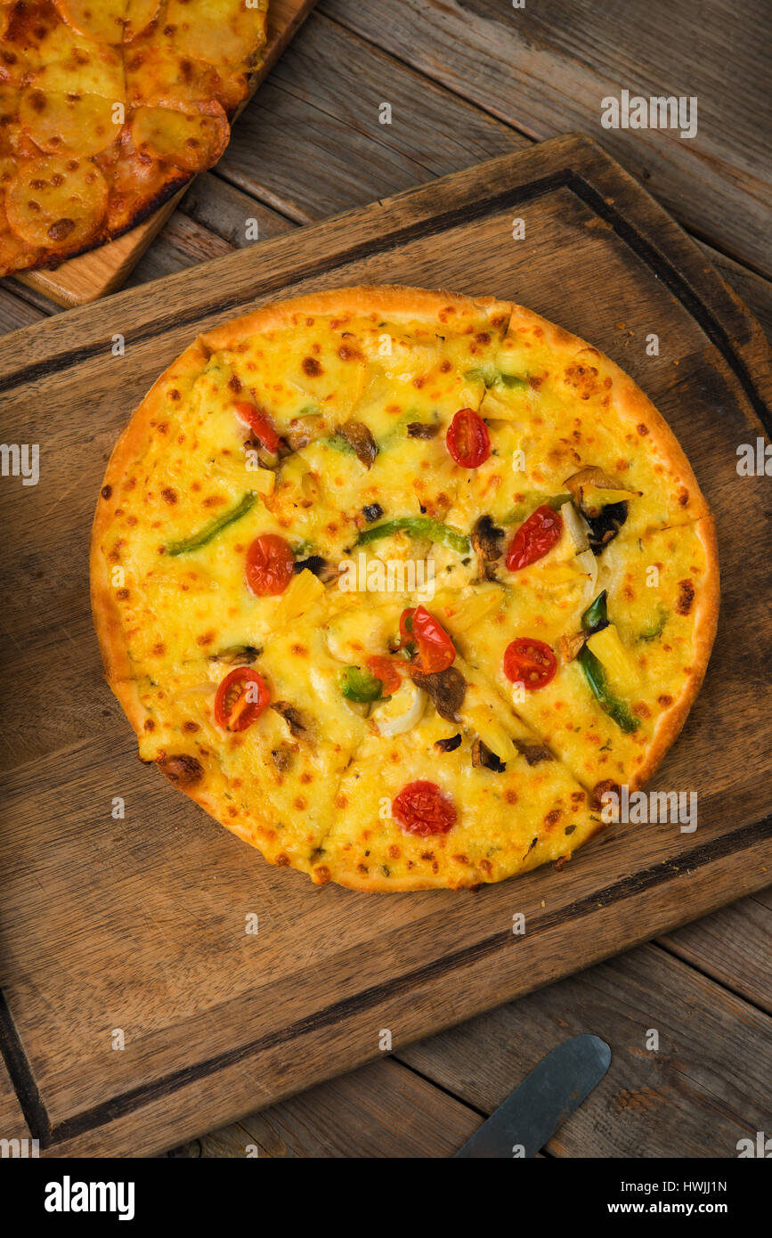pizza top view in rustic setting Stock Photo - Alamy