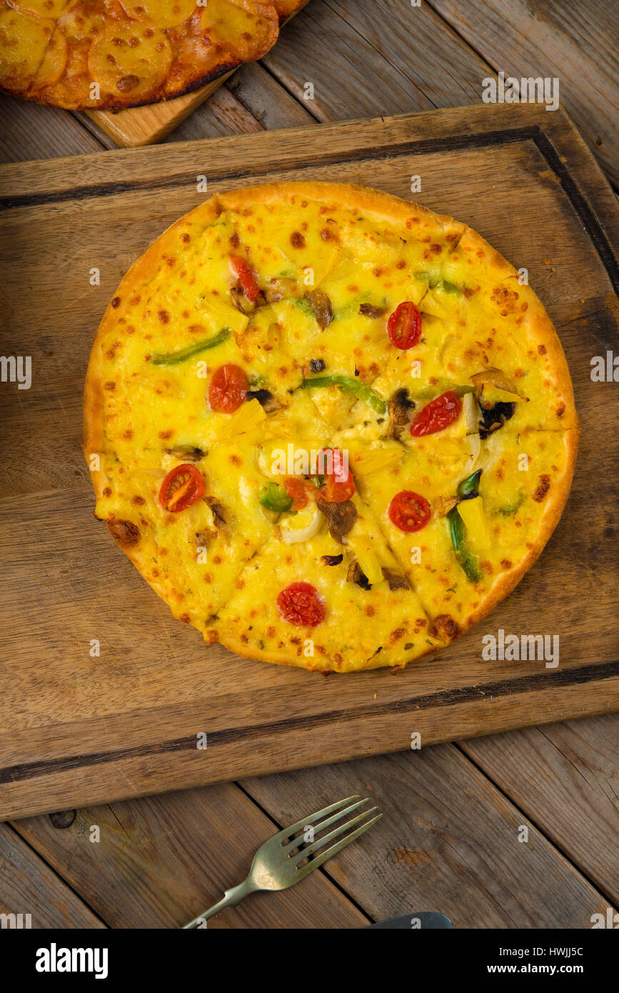 pizza top view in rustic setting Stock Photo - Alamy