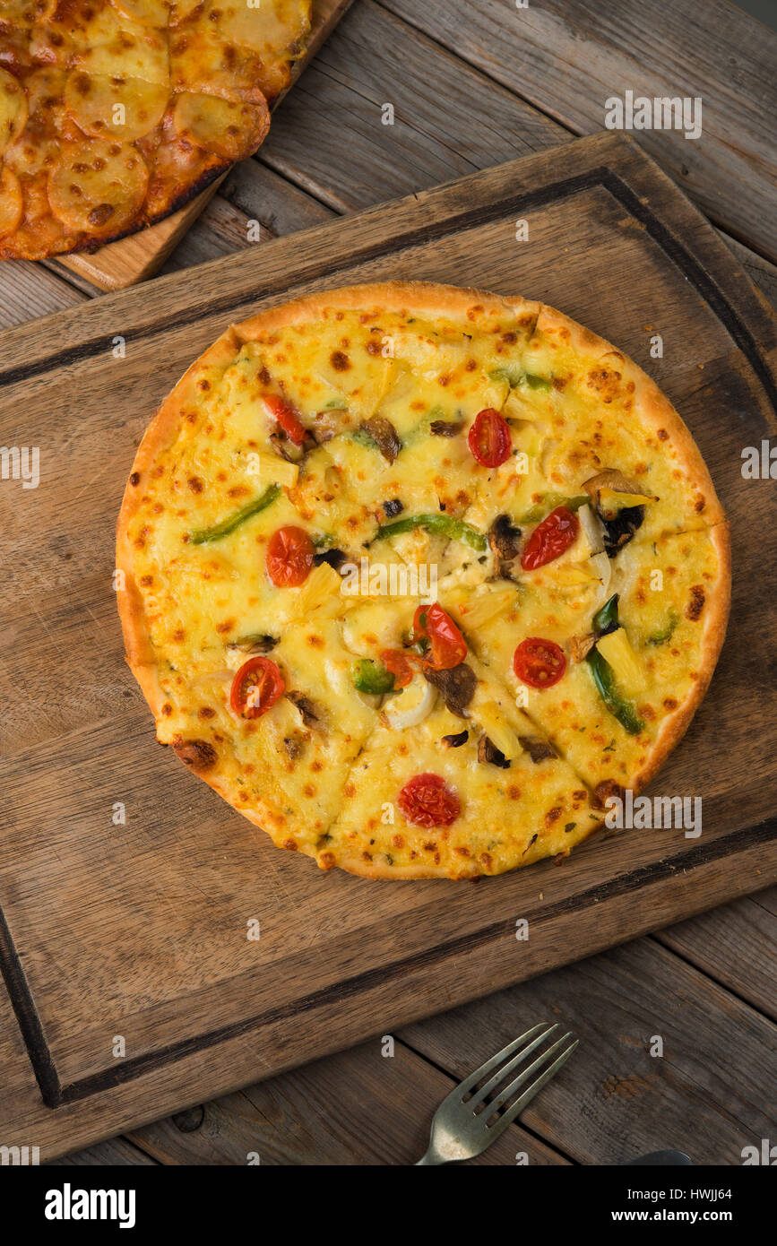pizza top view in rustic setting Stock Photo - Alamy