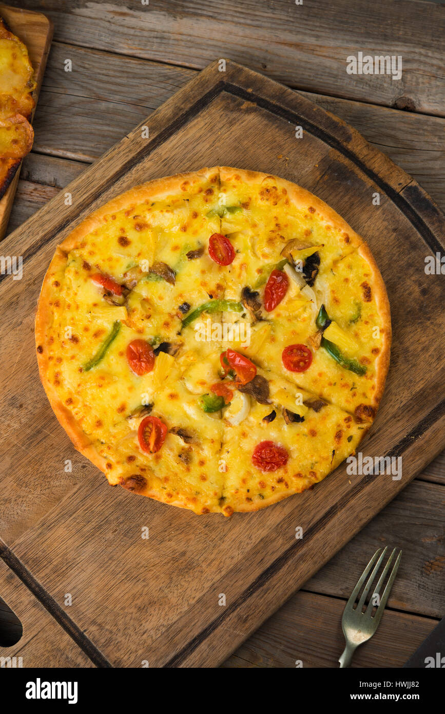 pizza top view in rustic setting Stock Photo - Alamy