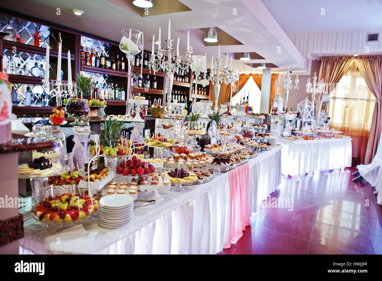 Wedding reception table with different fruits, cakes and sweets Stock ...