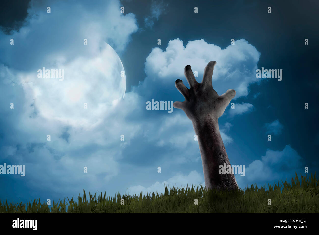 Zombie hand out of ground hi-res stock photography and images - Alamy
