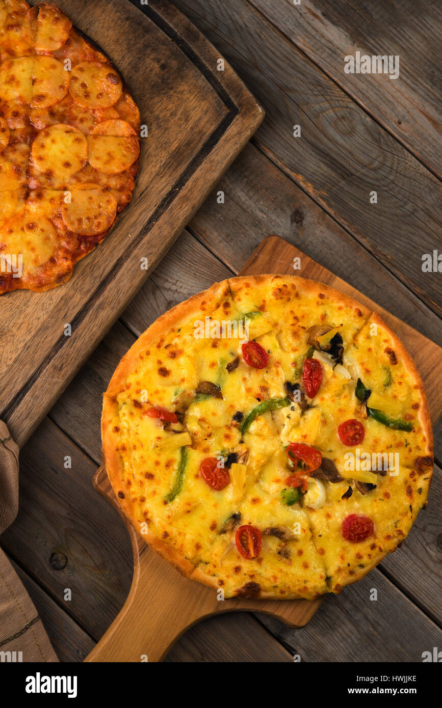pizza top view in rustic setting Stock Photo - Alamy