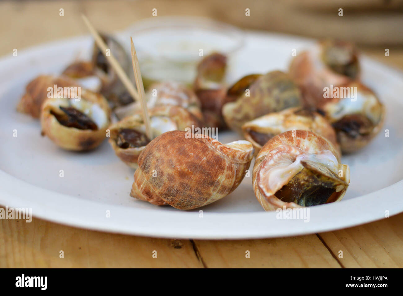 Cooked escargot at the street food market in Bangkok, Thailand Stock ...