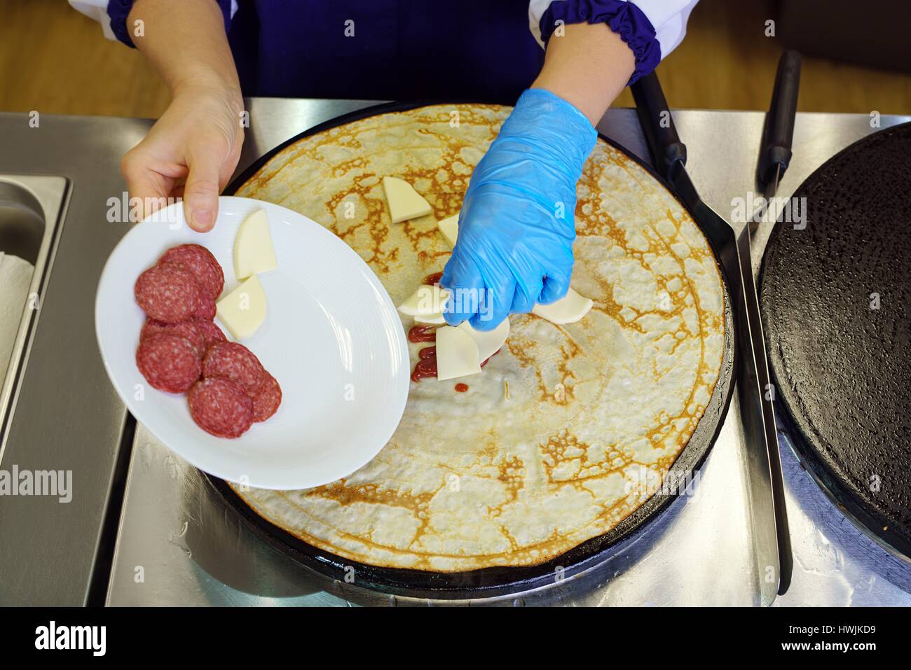 Pancake on frying pan view from above in a cafe Stock Photo - Alamy