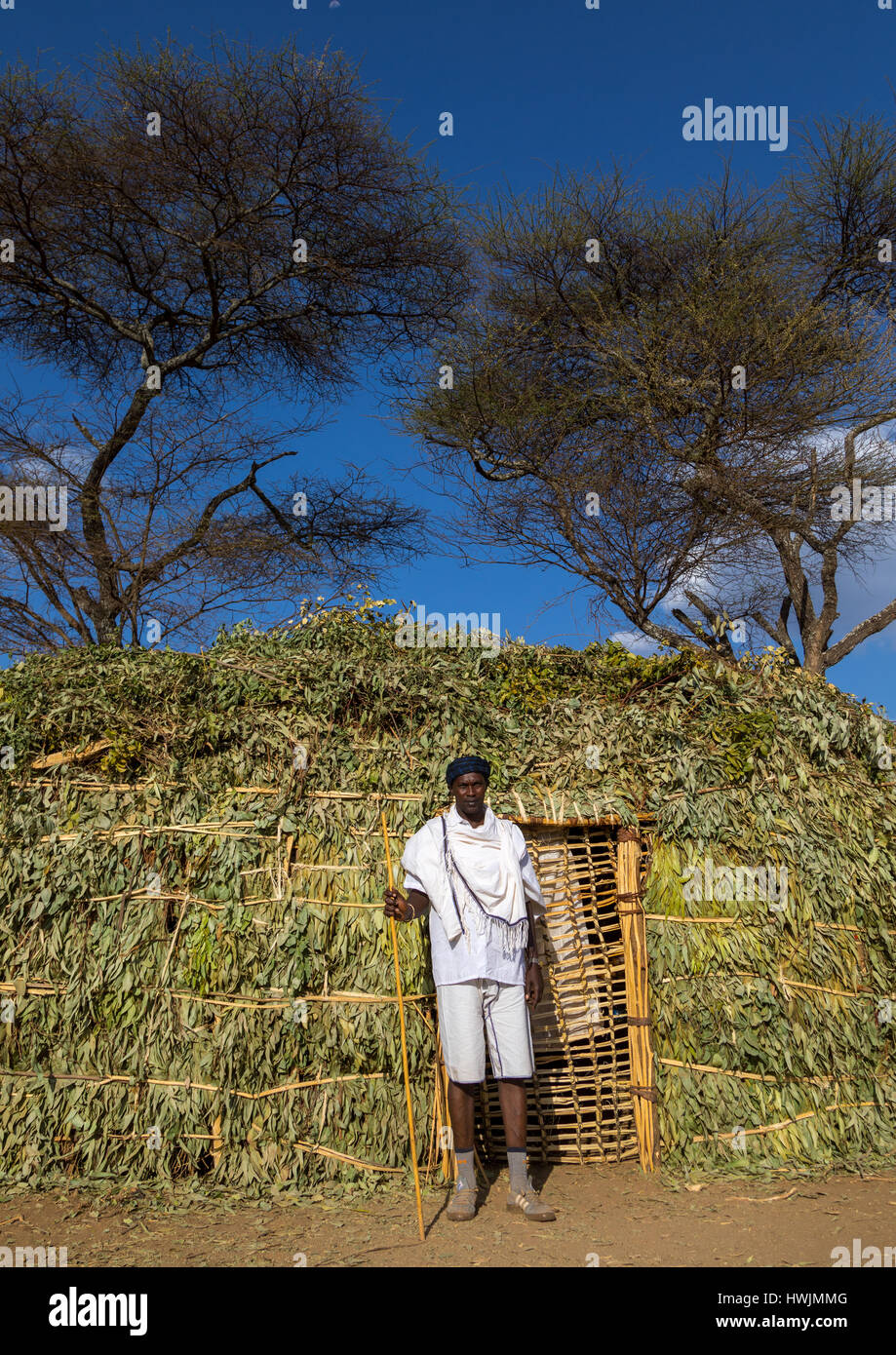 Borana man standing in front of a hut during the Gada system ceremony ...