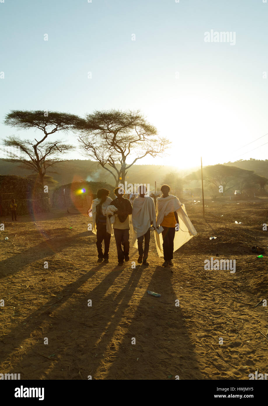 Men walking in the early morning during the Gada system ceremony in ...