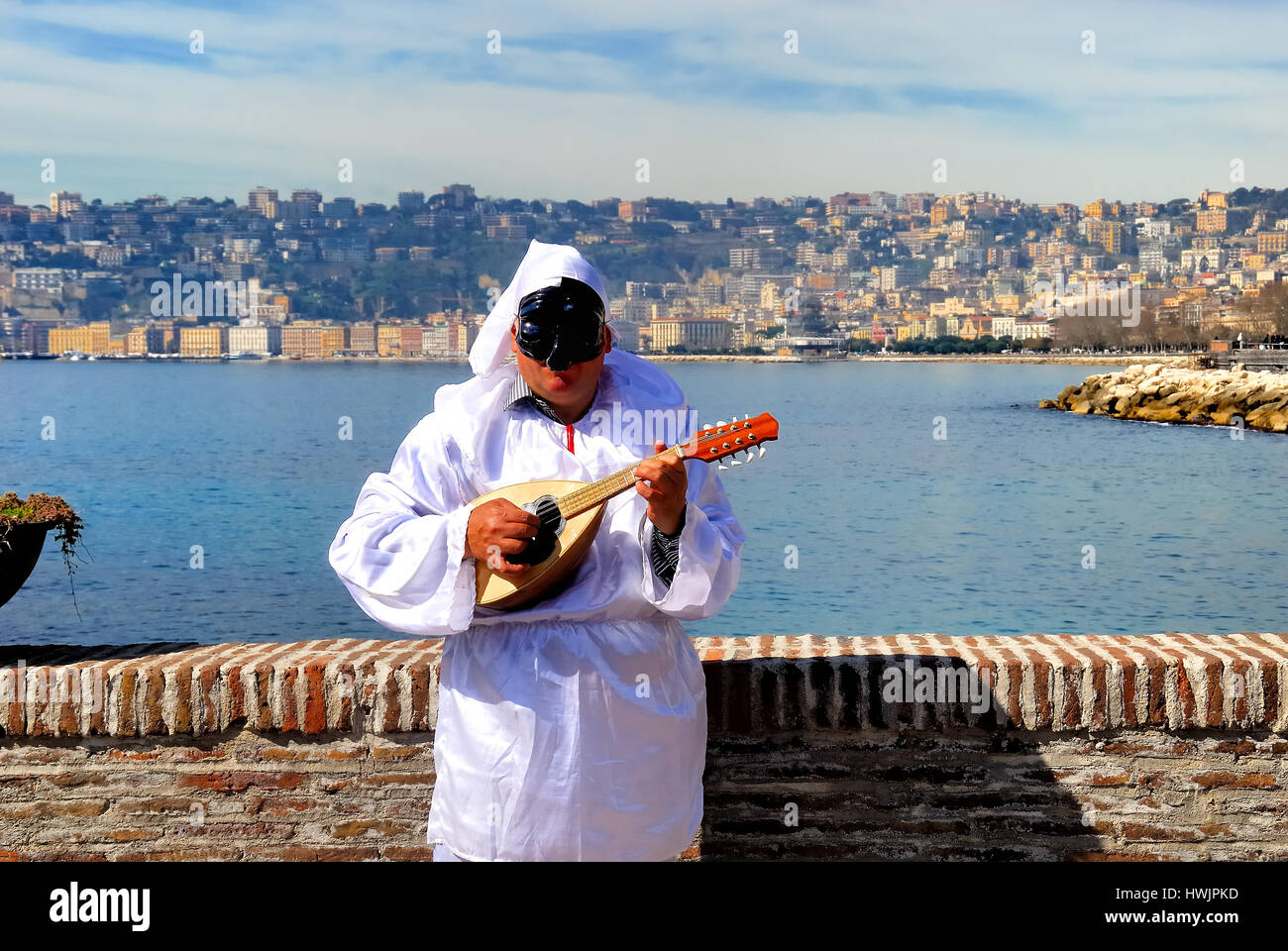Naples, Italy. The mask of Pulcinella (Punchinello) plays the mandolin ...