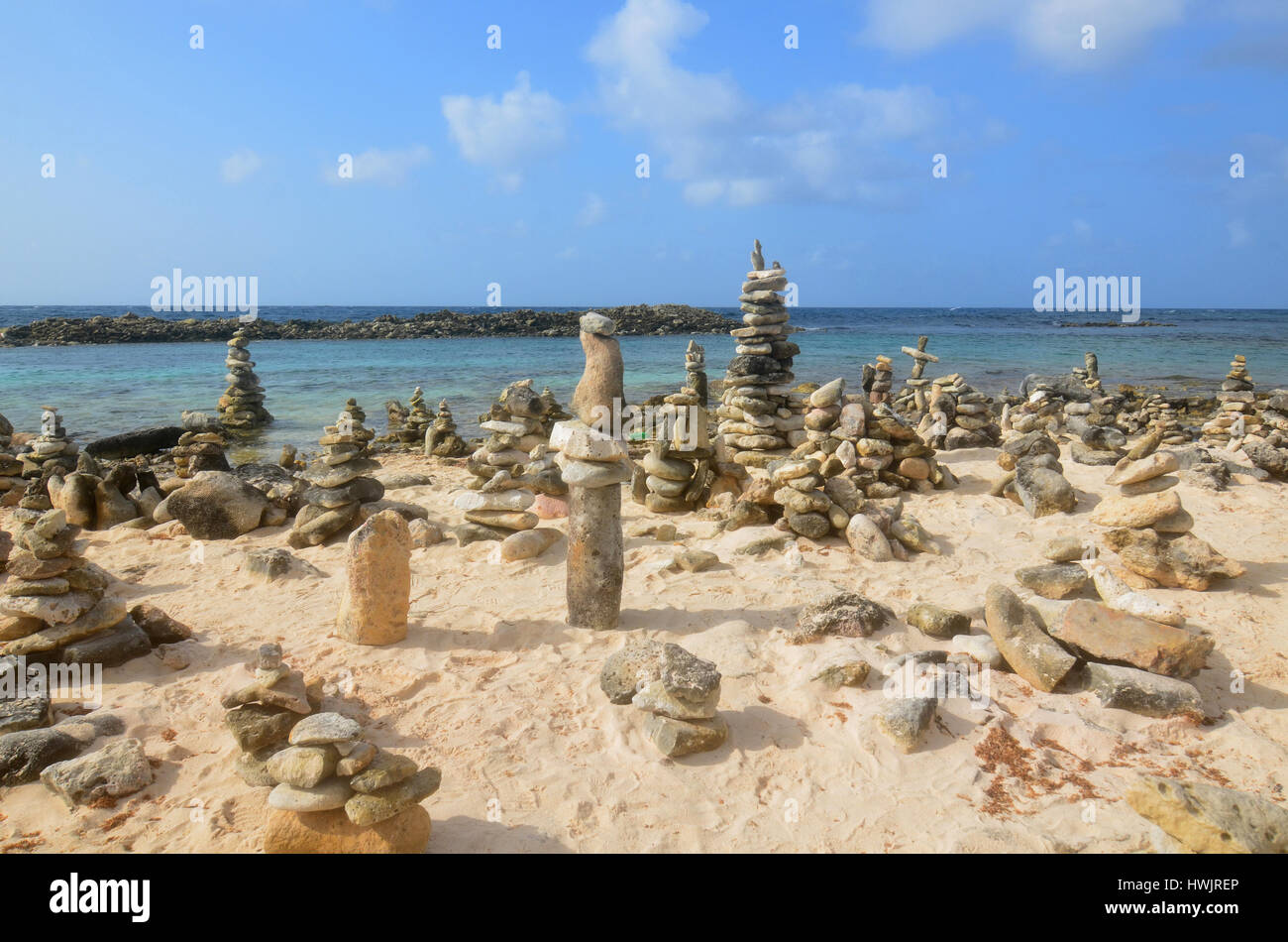 Stacked stone cairns on Baby Beach in Aruba Stock Photo - Alamy