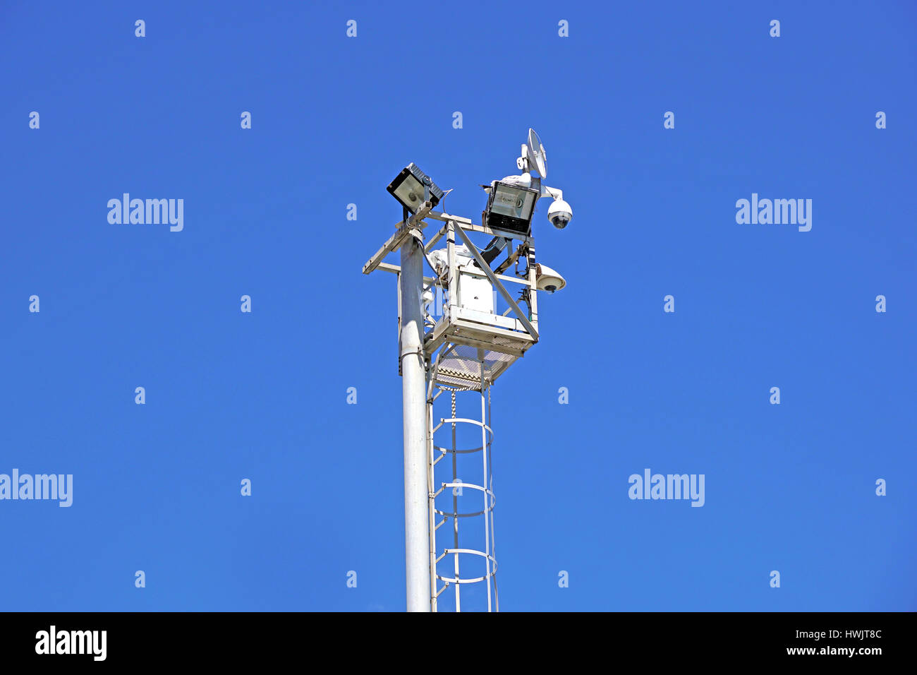 pole with lights, security camera and antennas Stock Photo - Alamy