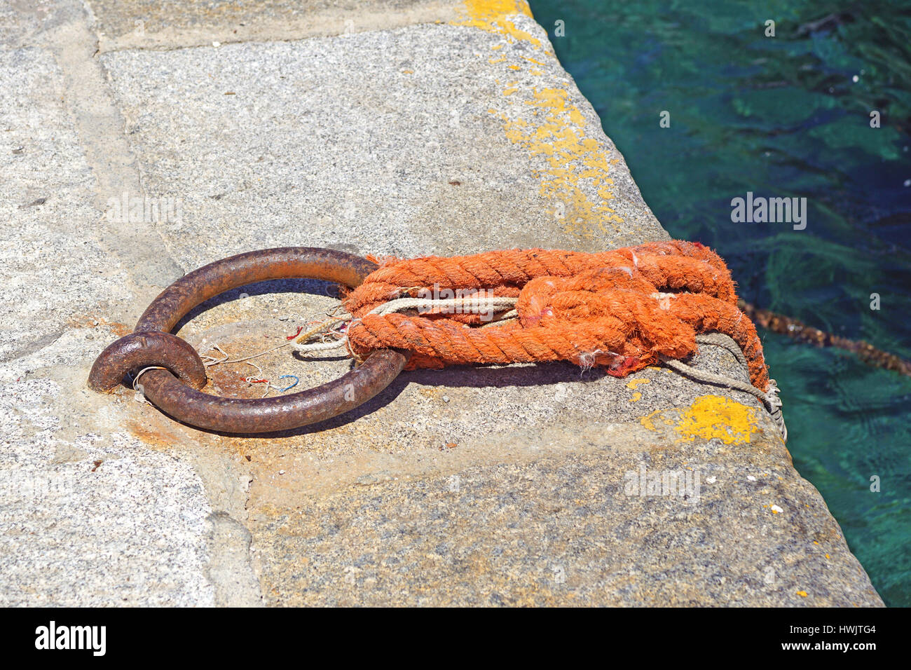 mooring dock with nautical ropes chains Stock Photo - Alamy