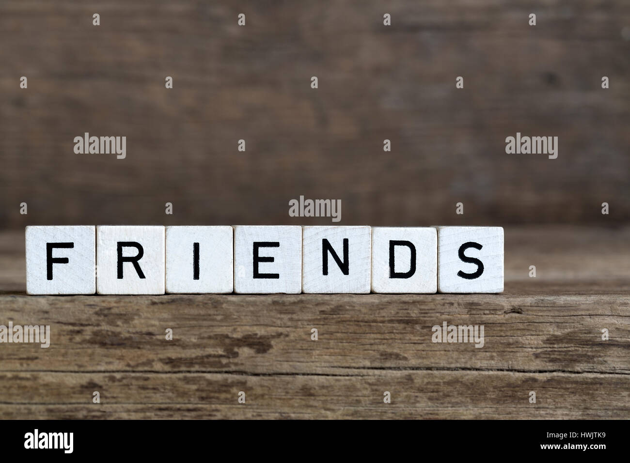 Friends, written in cubes on a wooden background Stock Photo - Alamy