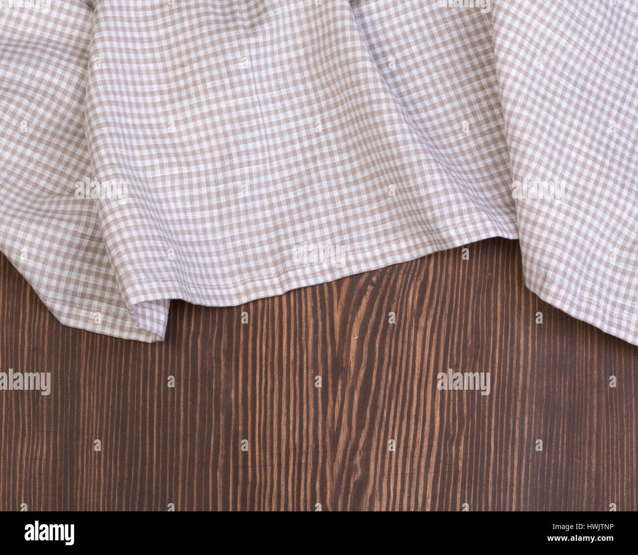 checkered tablecloth on wooden table background Stock Photo - Alamy