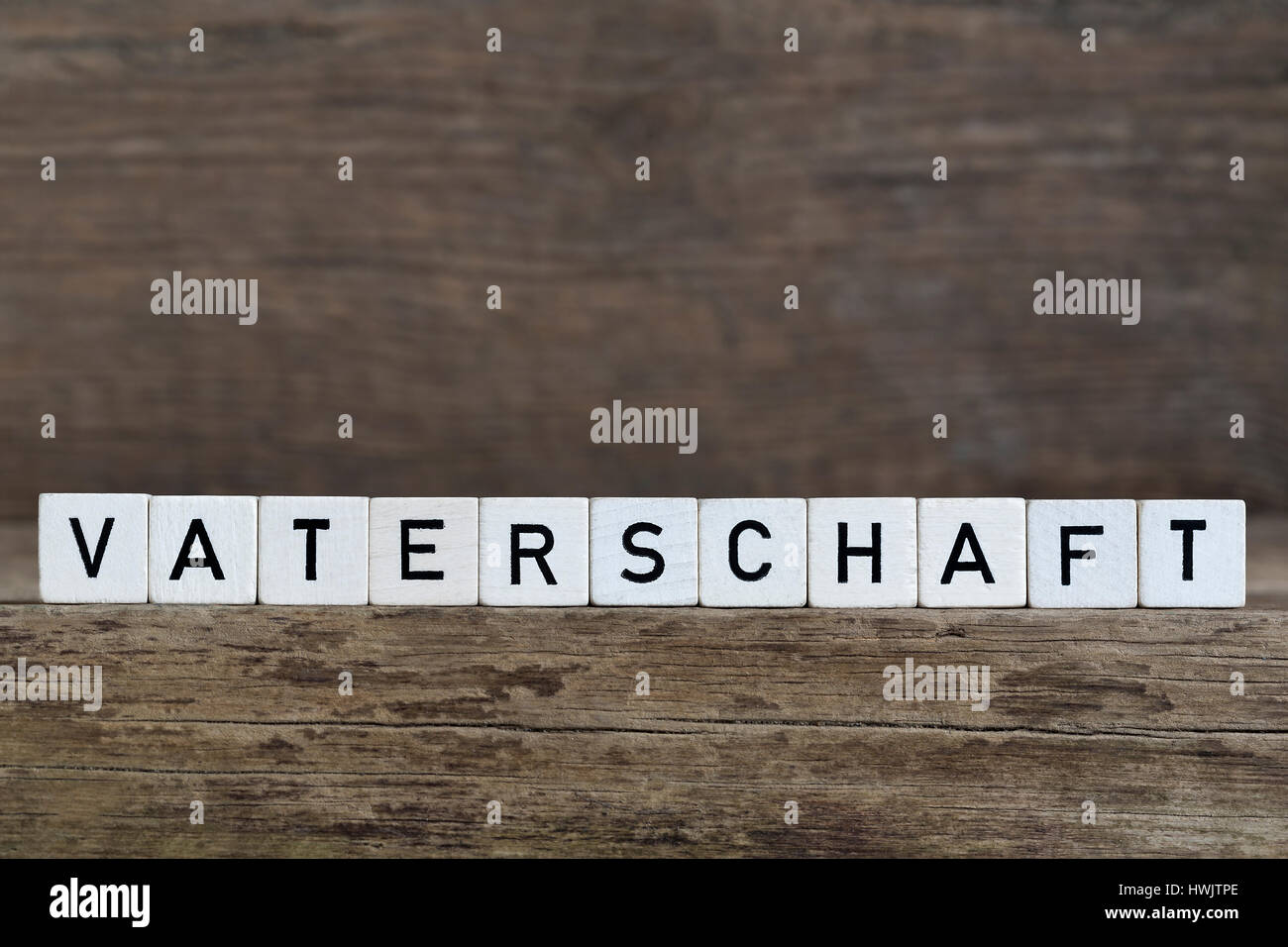 German word fatherhood, written in cubes on a wooden background Stock ...