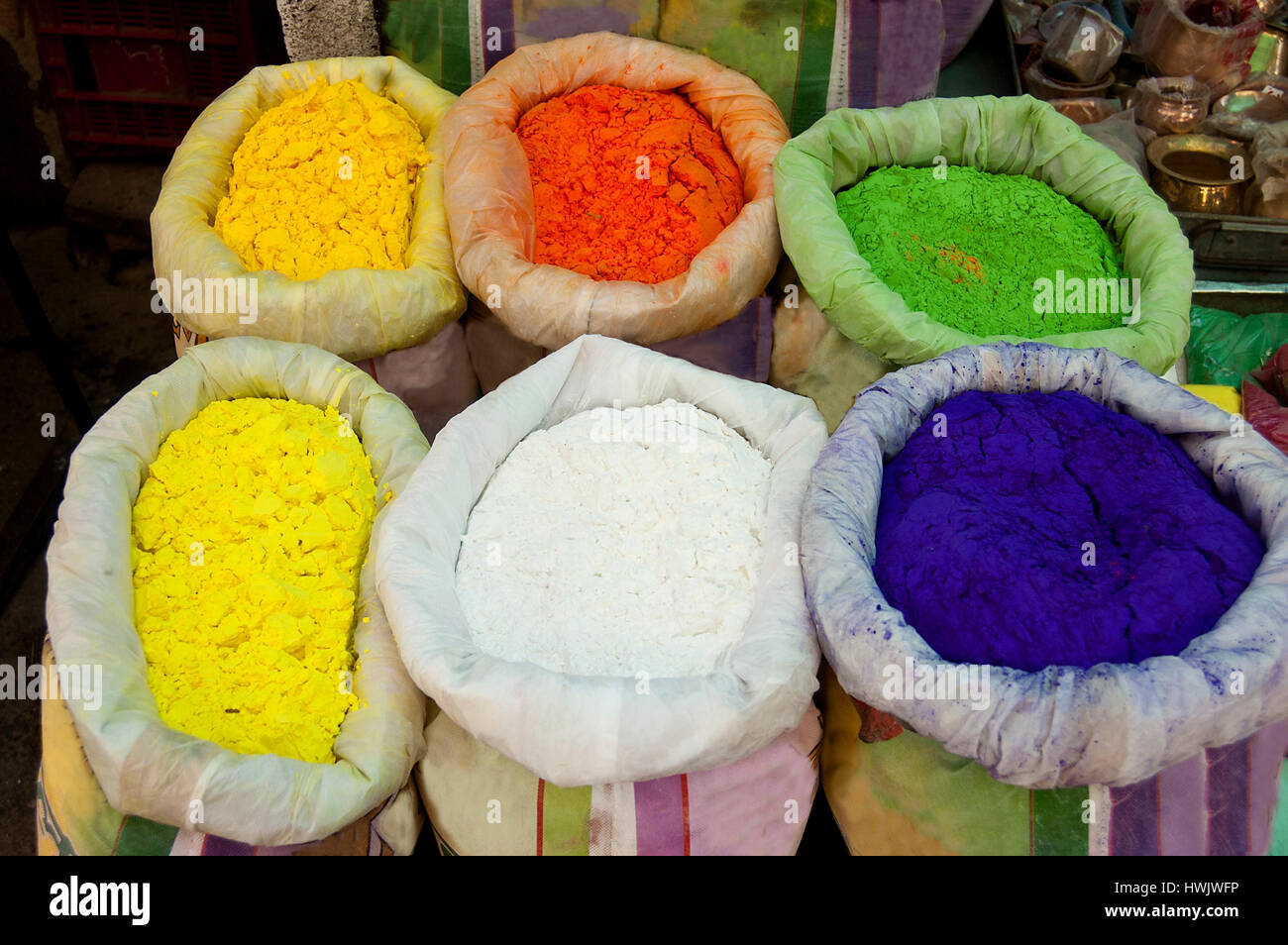 Various colorful dry pigments, placed in sacks. Closeup outdoor shot ...