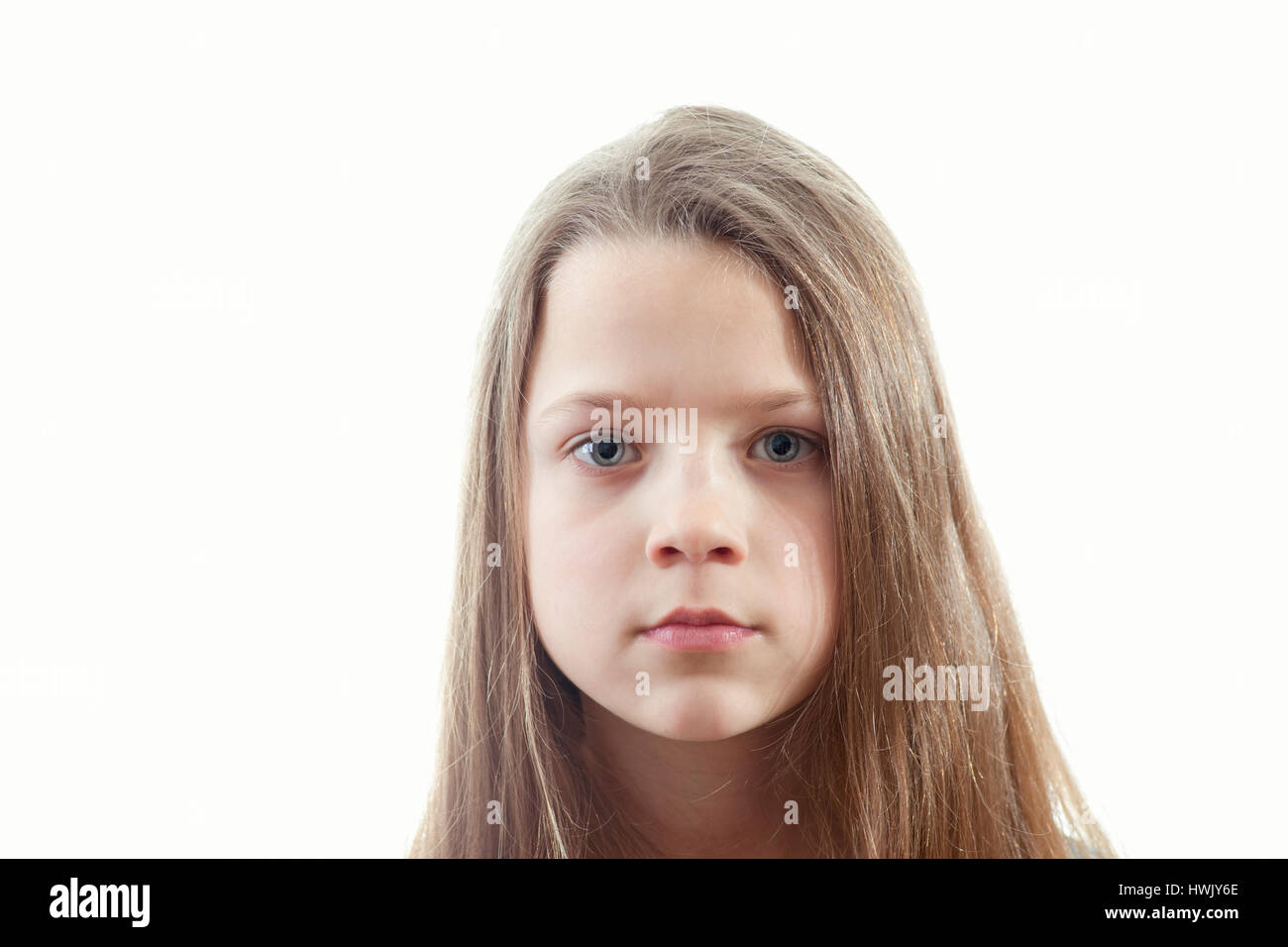 serious child girl head portrait with long hairs isolated on white ...