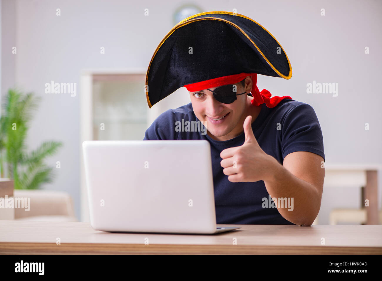 Digital security concept with pirate at computer Stock Photo - Alamy