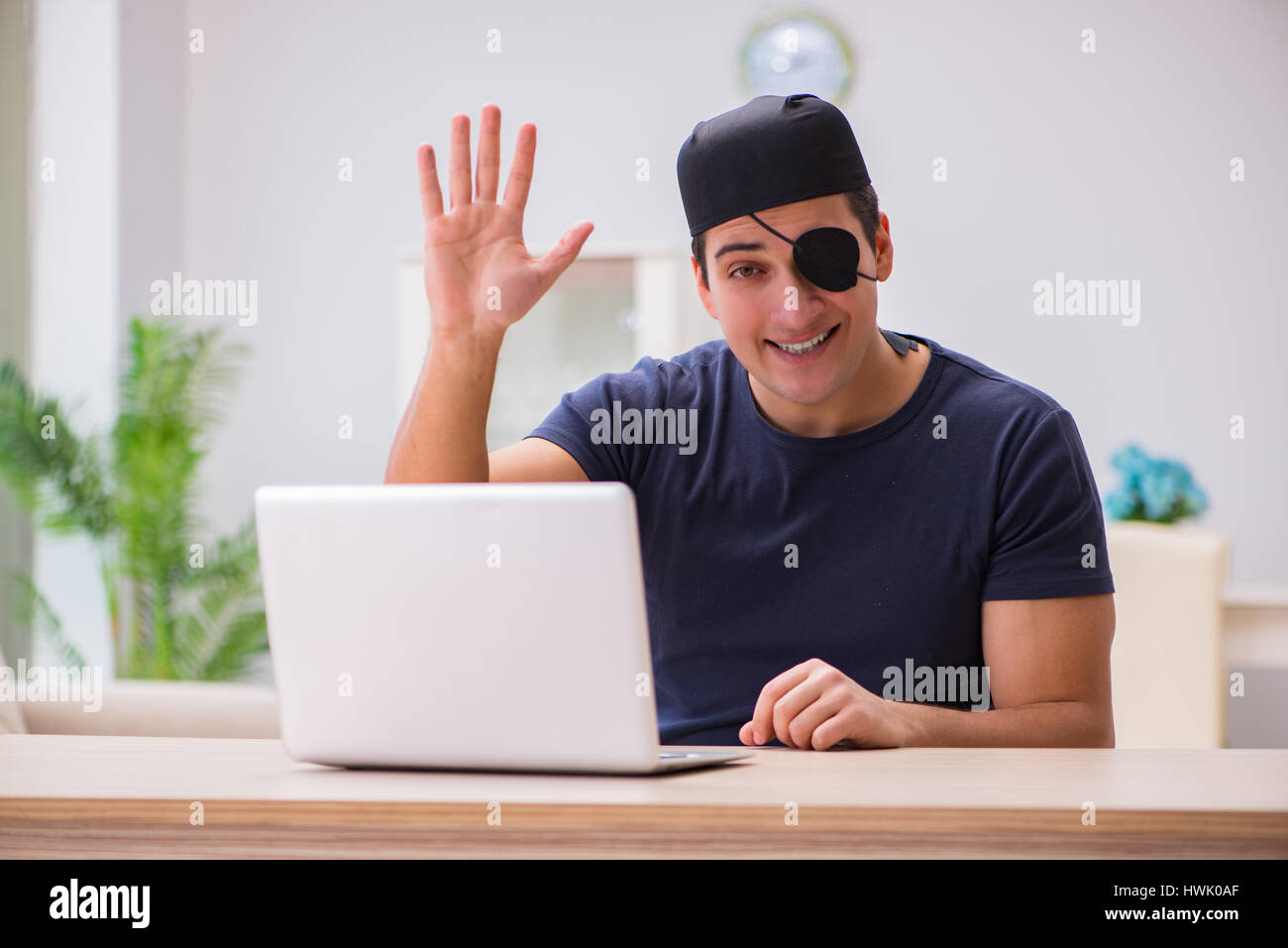 Digital security concept with pirate at computer Stock Photo - Alamy
