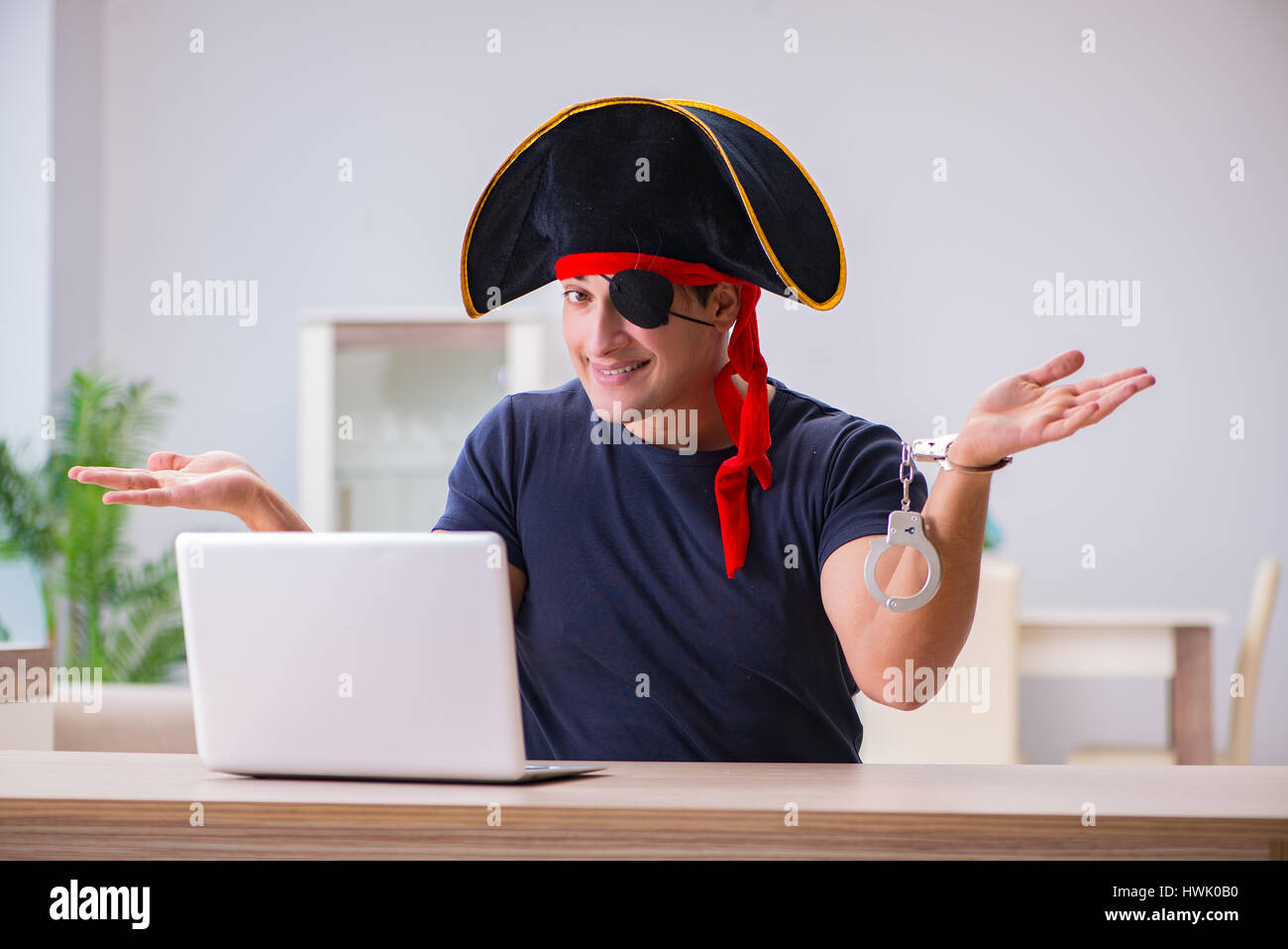 Digital security concept with pirate at computer Stock Photo - Alamy