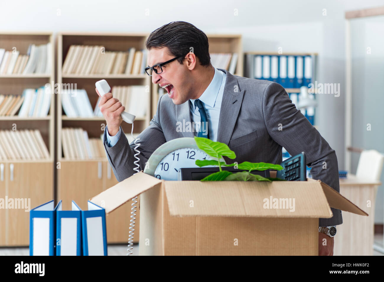 Man moving office with box and his belongings Stock Photo - Alamy