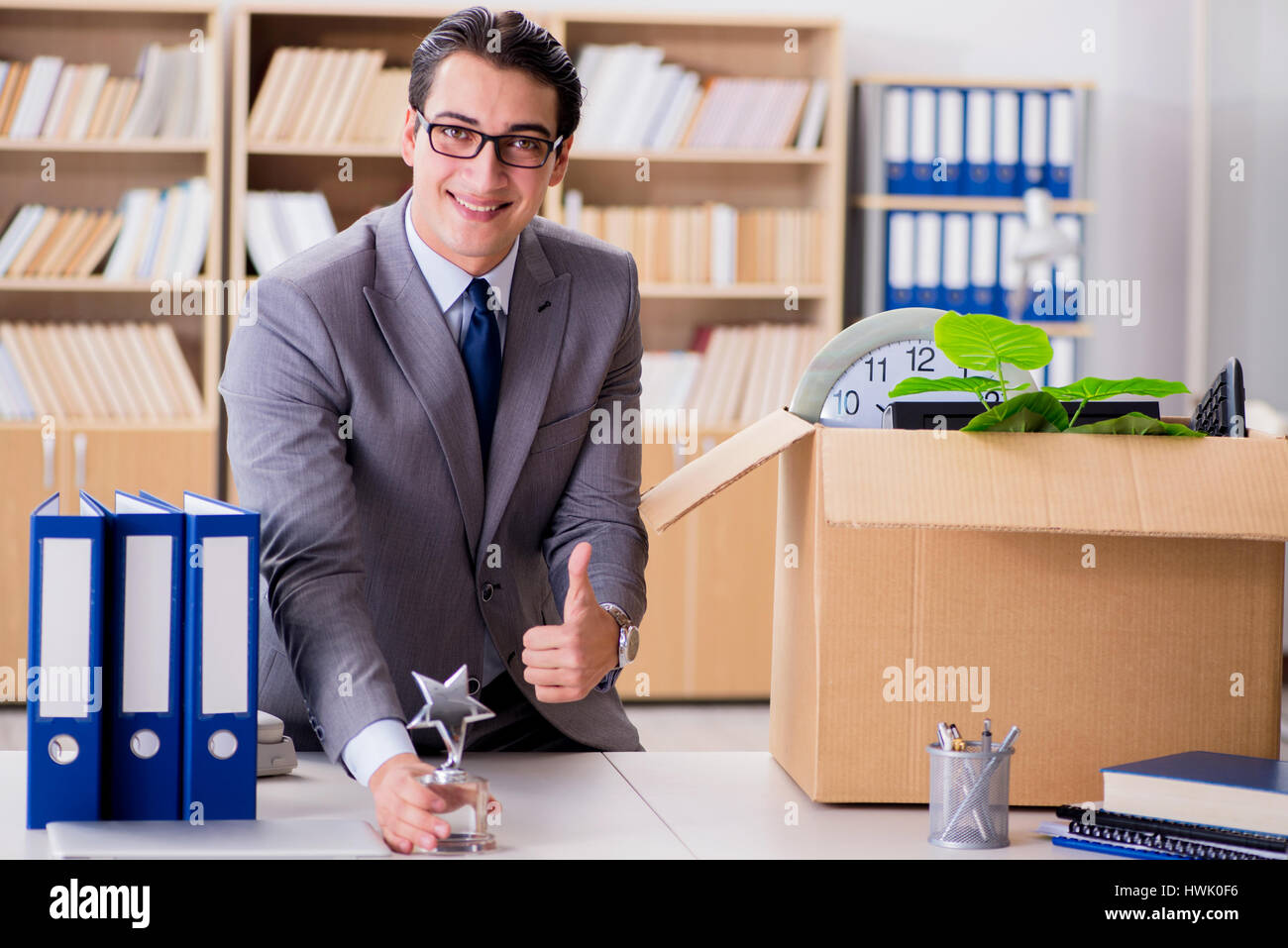 Man moving office with box and his belongings Stock Photo - Alamy