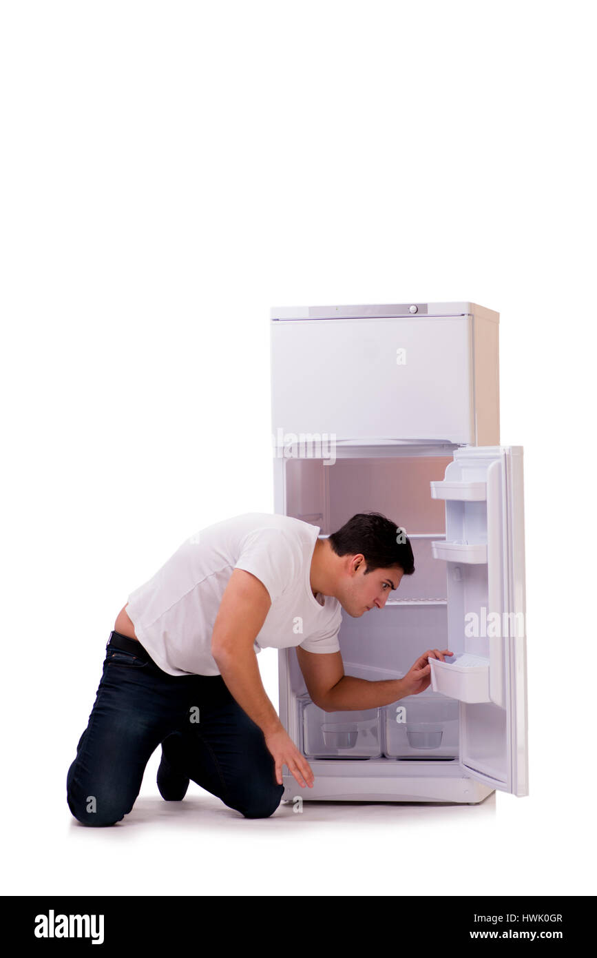 Man looking for food in empty fridge Stock Photo - Alamy