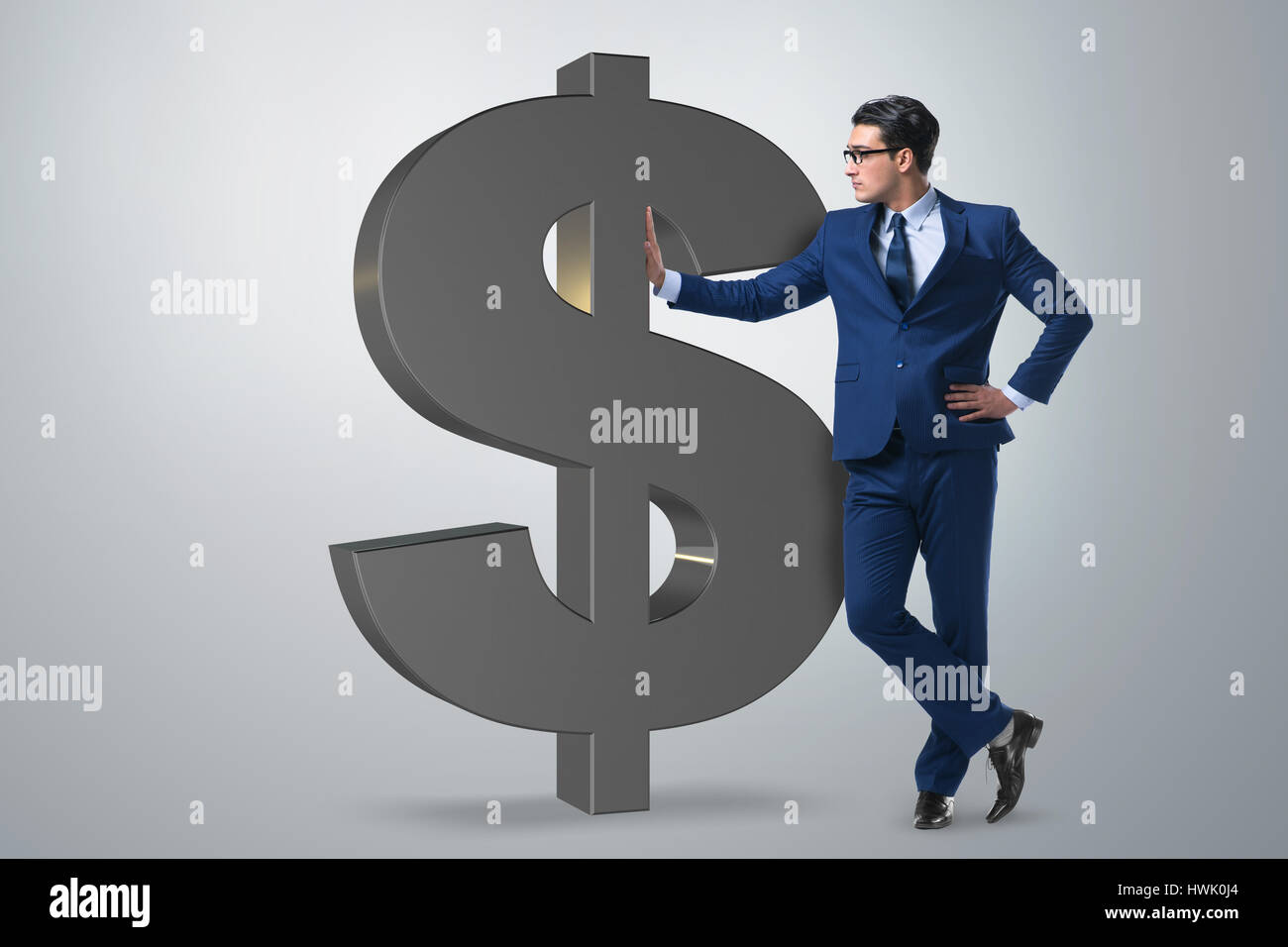 Businessman next to dollar sign Stock Photo - Alamy