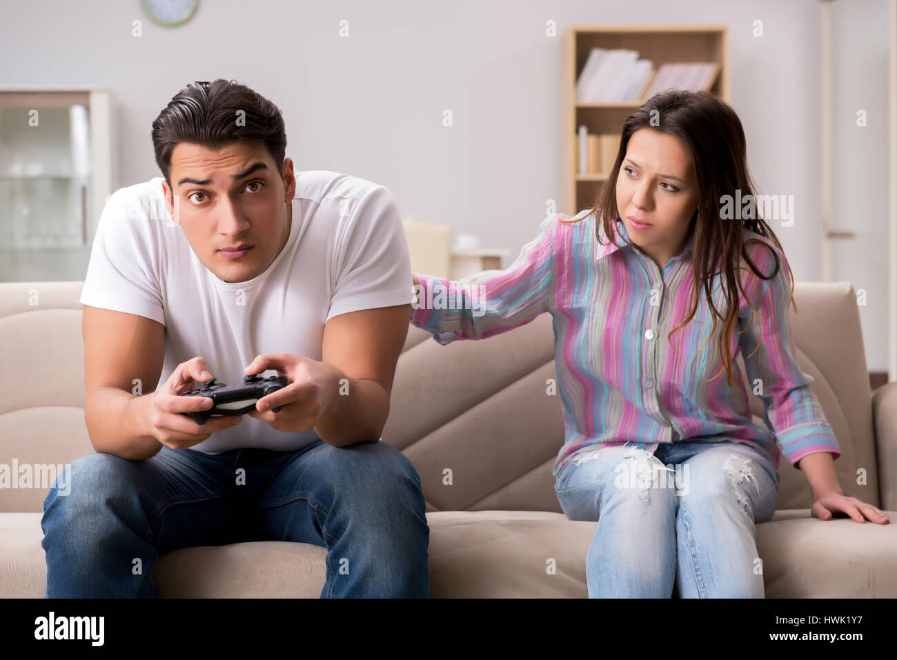 Young family suffering from computer games addiction Stock Photo - Alamy