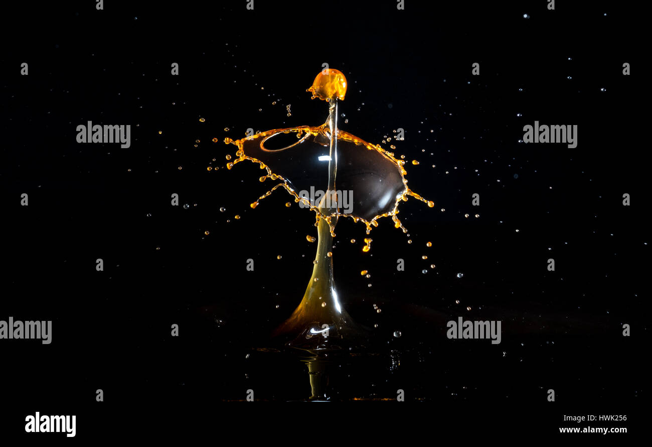 Images forming two drops of water when colliding after falling in water ...