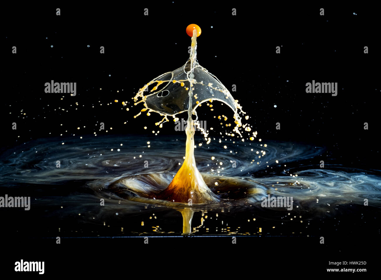 Images forming two drops of water when colliding after falling in water ...
