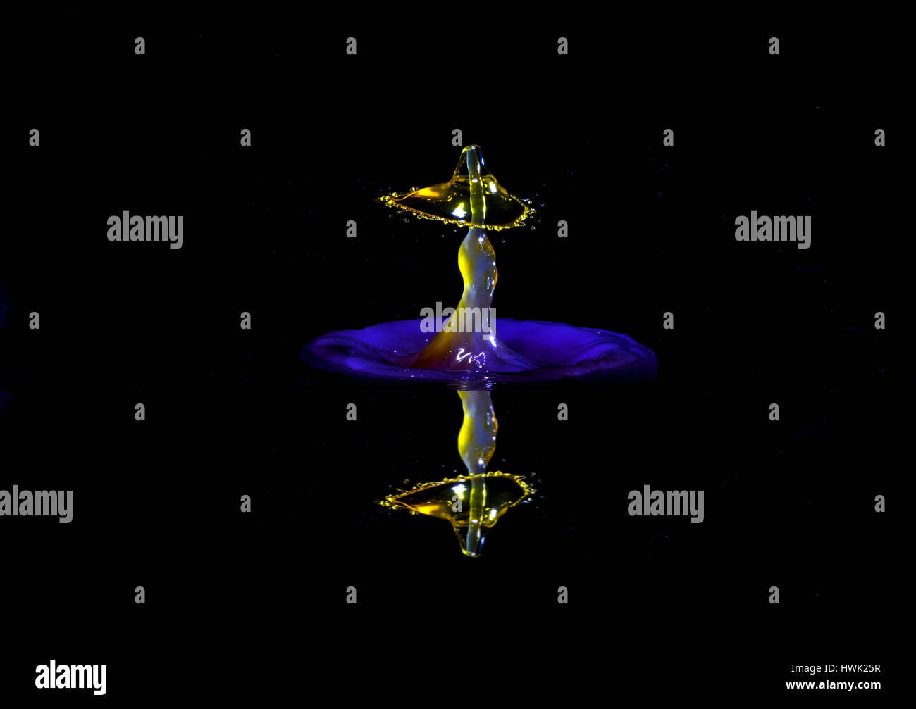 Images forming two drops of water when colliding after falling in water ...
