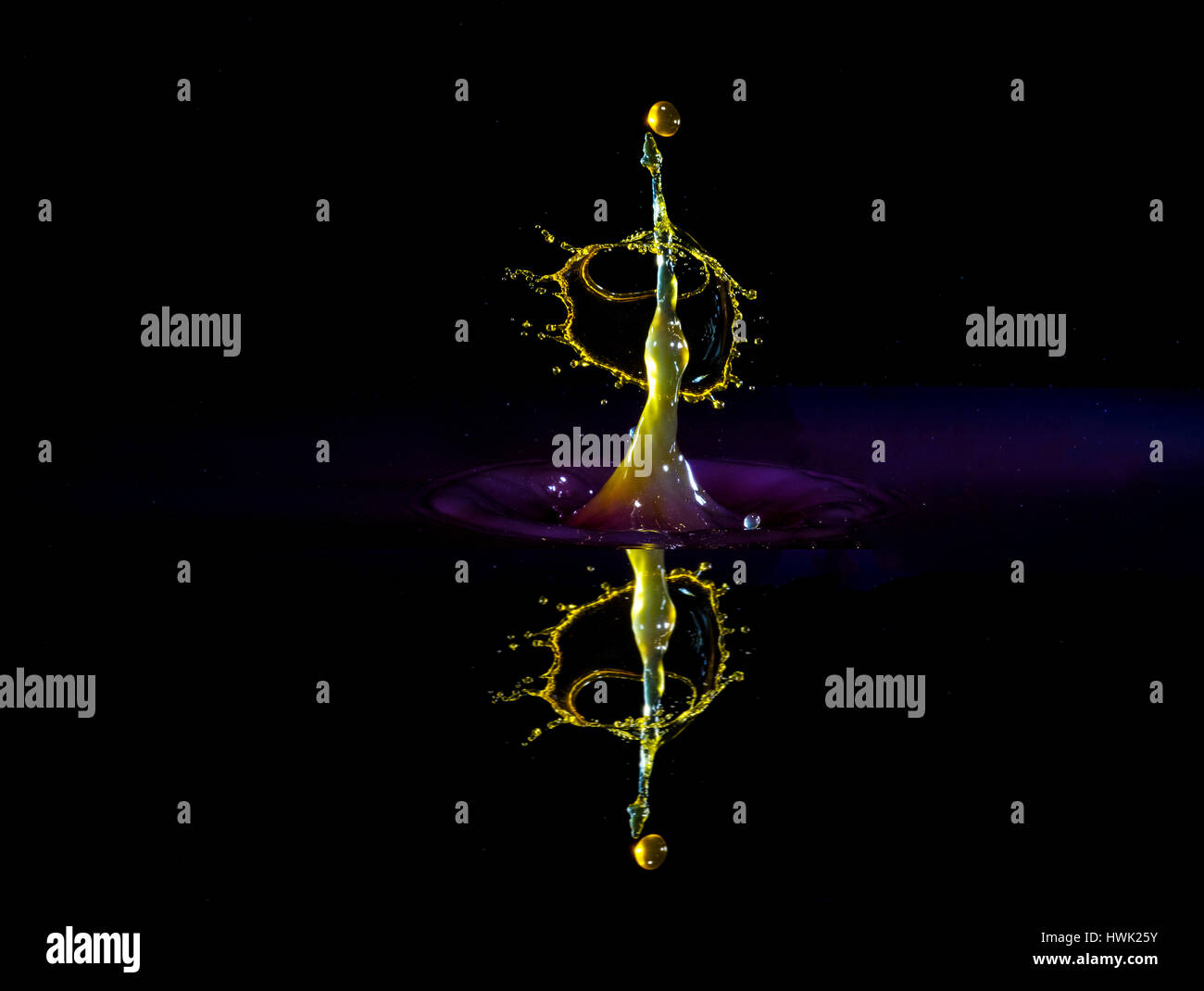 Images forming two drops of water when colliding after falling in water ...