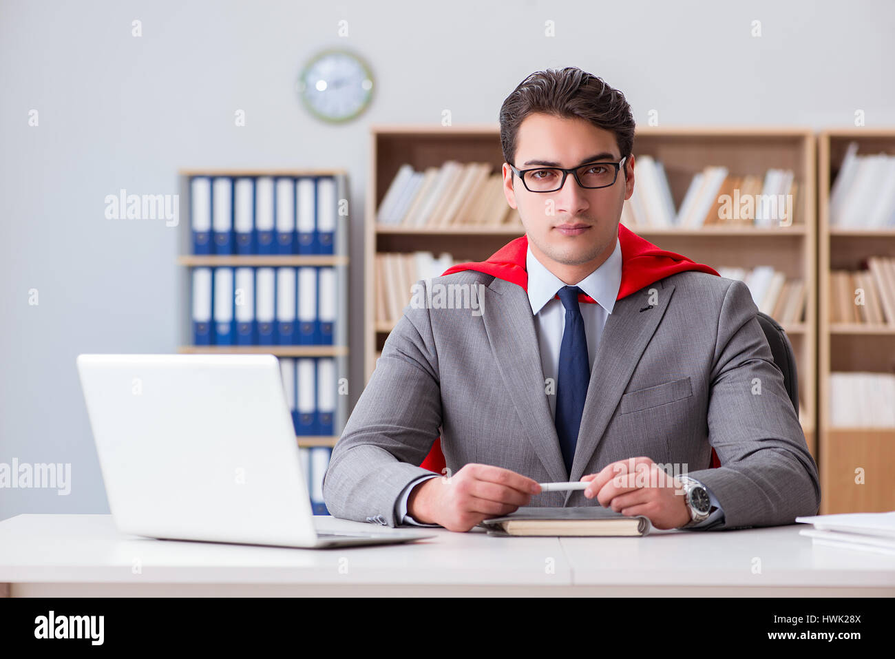 Superhero businessman working in the office Stock Photo - Alamy