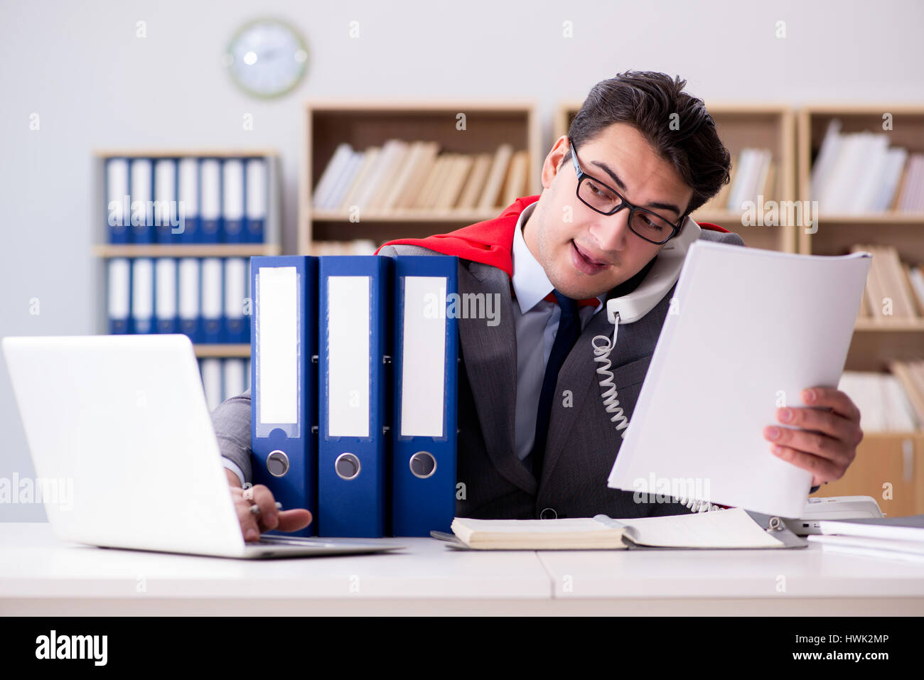 Superhero businessman working in the office Stock Photo - Alamy