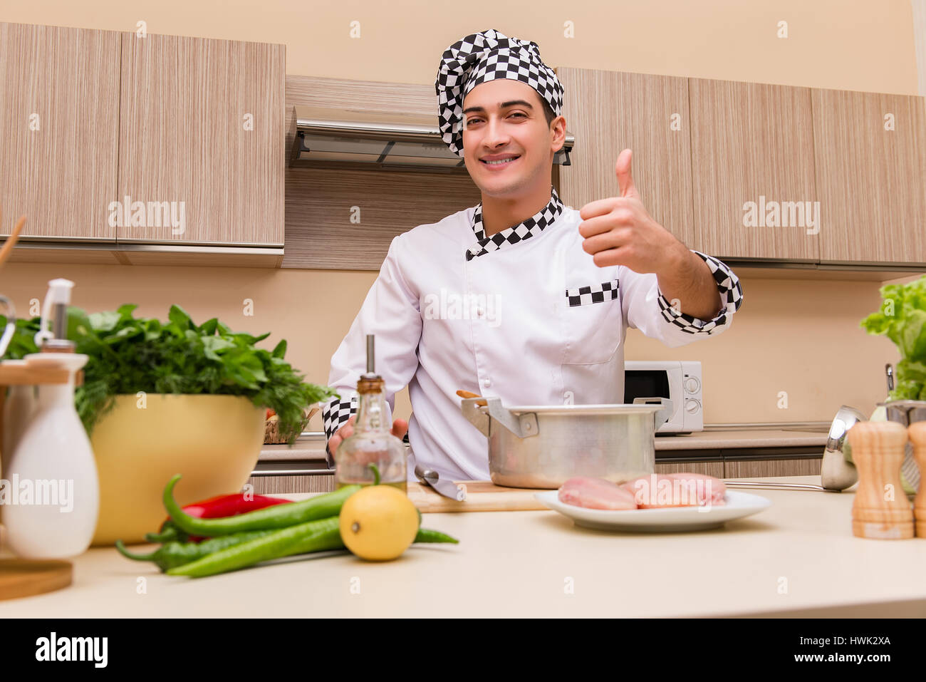 Young chef working in the kitchen Stock Photo - Alamy