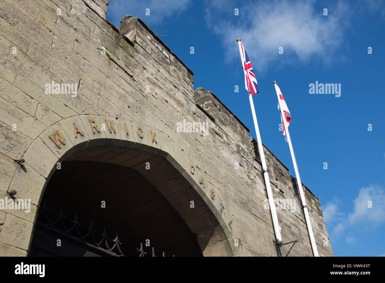 Flags at the entrance to Warwick castle in Warwick town centre Stock ...