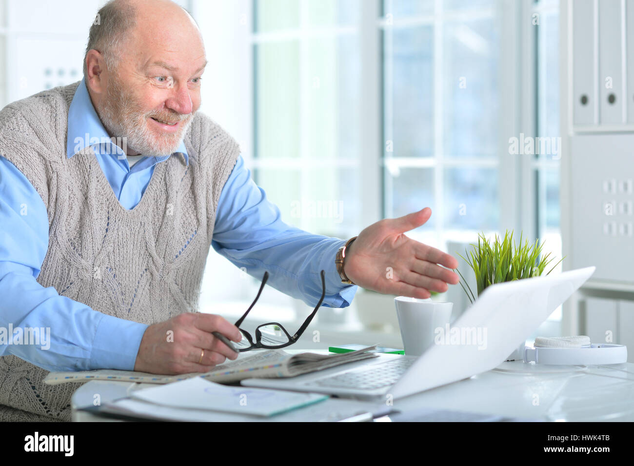 Portrait of an elderly man with a laptop Stock Photo - Alamy