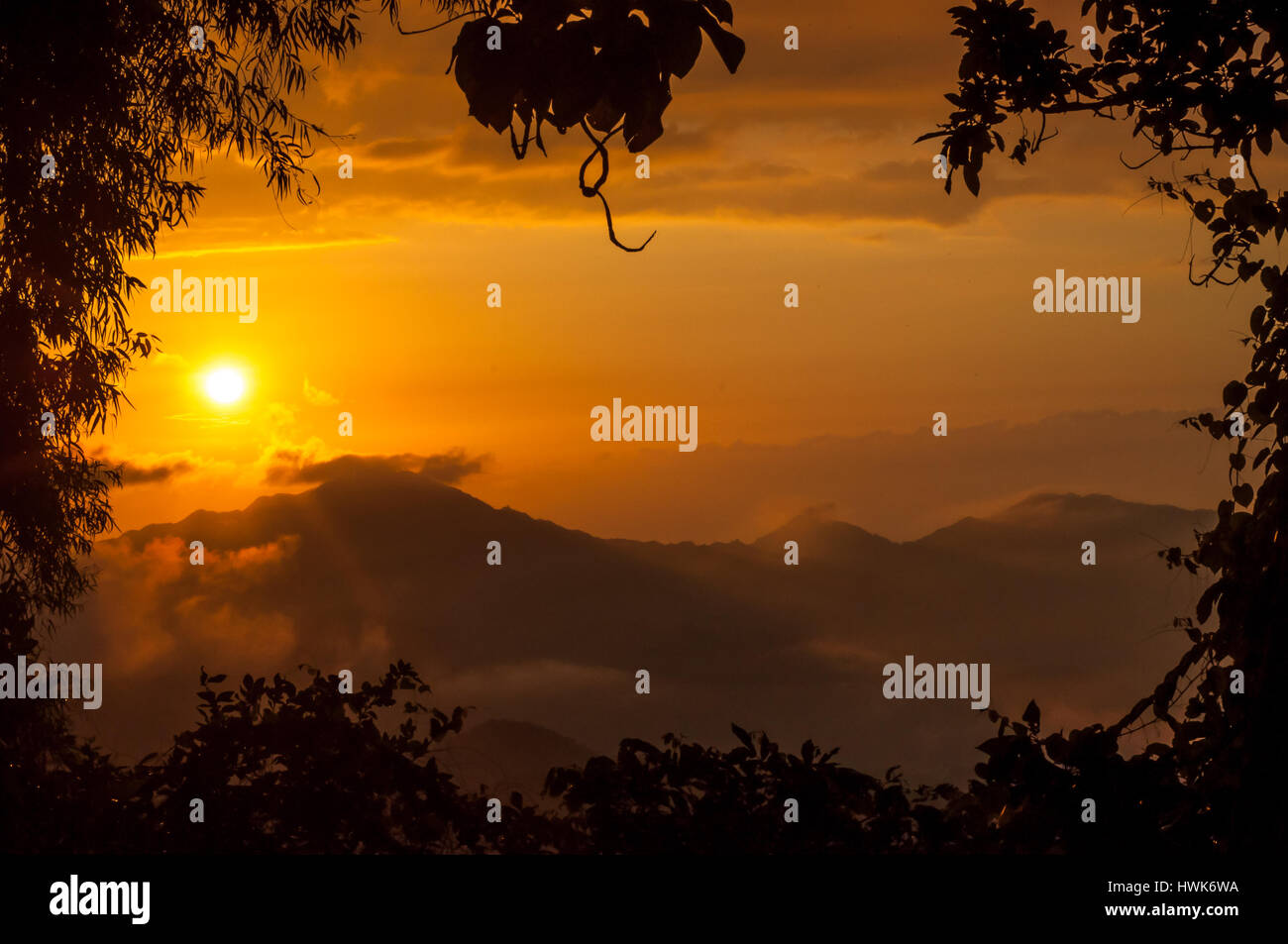 orange sunset in the mountains of Colombia Stock Photo - Alamy