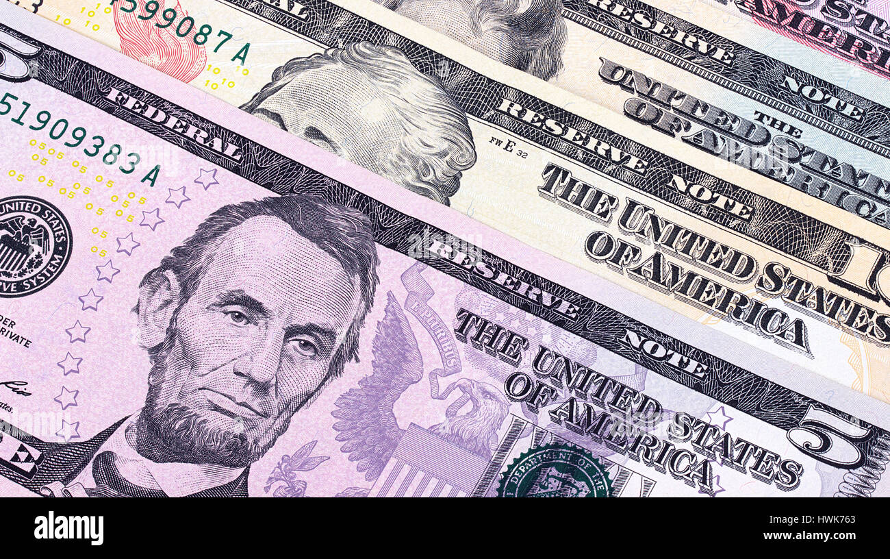 American dollar bills of different denominations abstract background ...