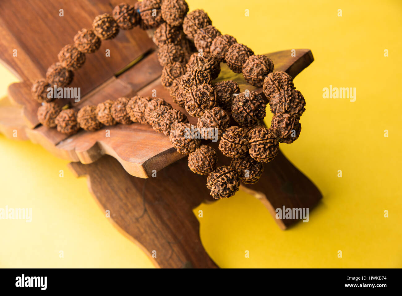 closeup picture of hand while doing Meditation with rudraksha mala or ...